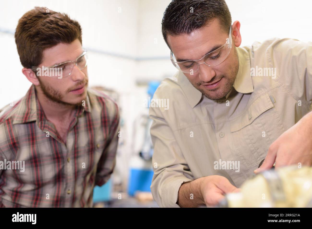 Male operator wearing goggles working hi-res stock photography and ...