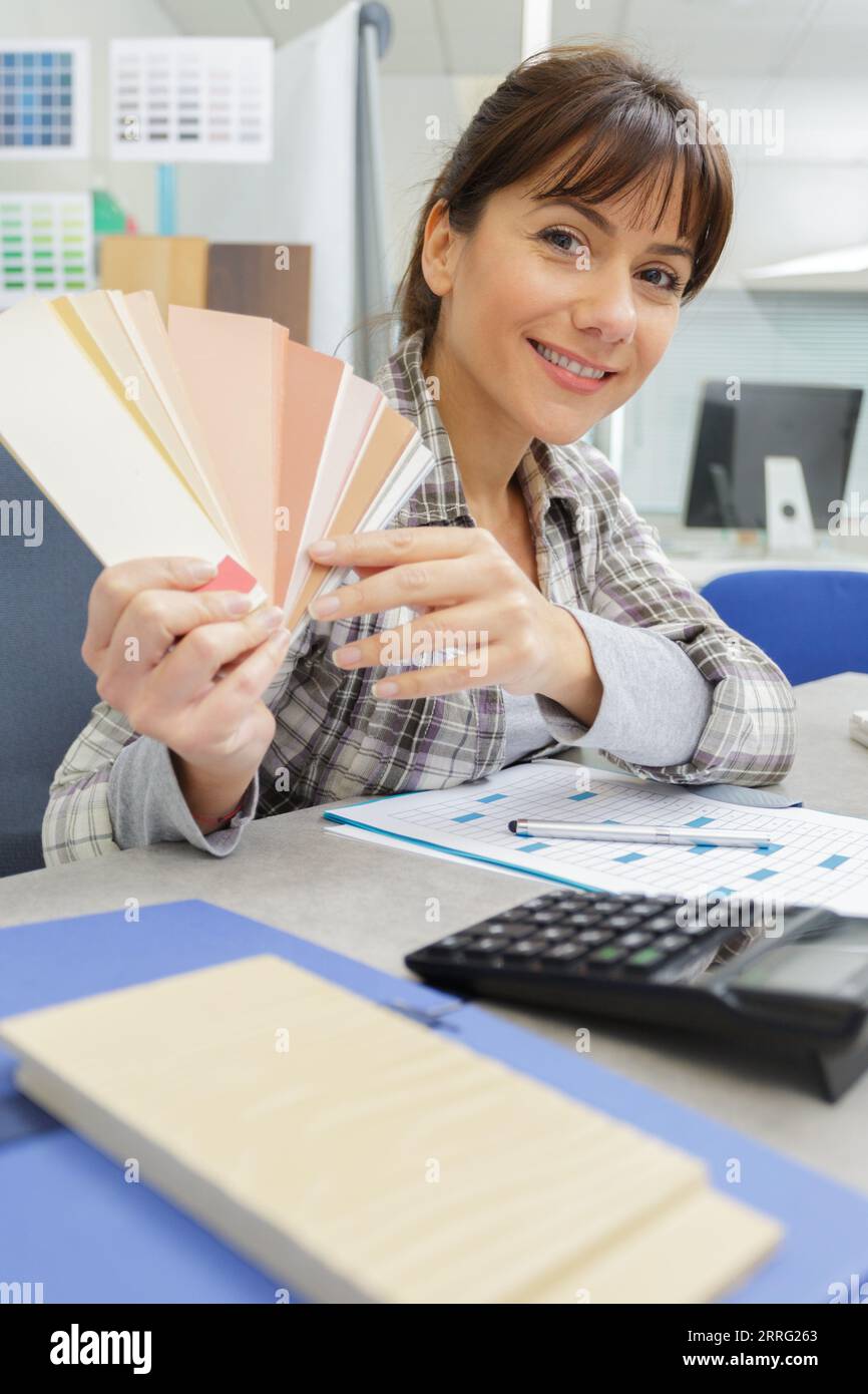 woman picking a color for her house walls Stock Photo - Alamy