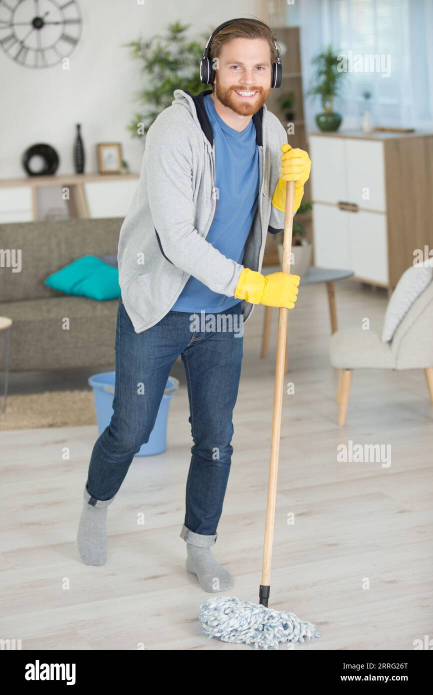 Man mopping floor hi-res stock photography and images - Alamy