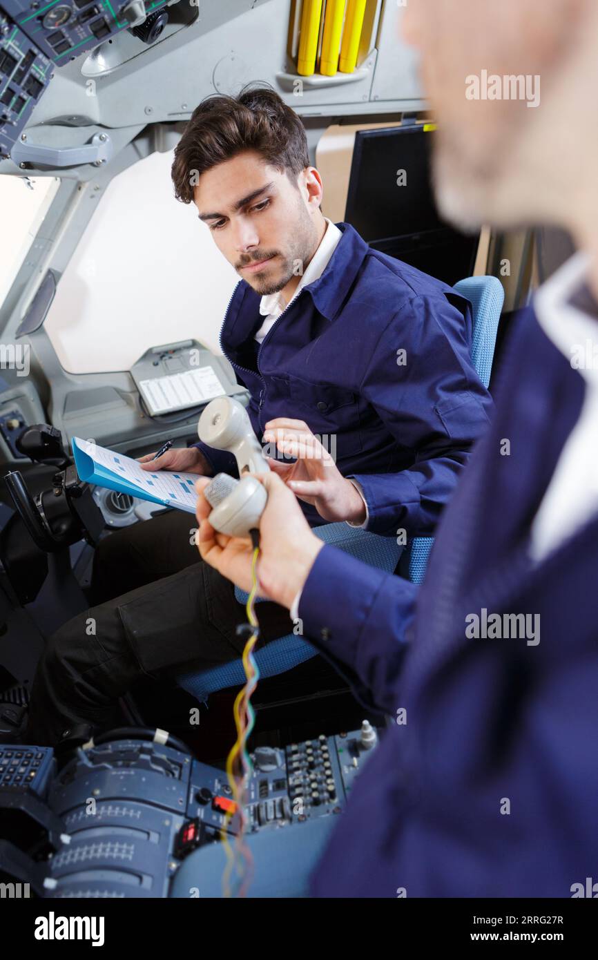 cockpit crew handling over a telephone Stock Photo - Alamy