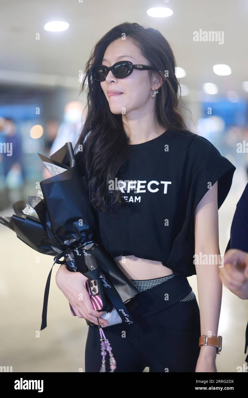 Hong Kong actress and fashion model Janice Man appears at the airport ...