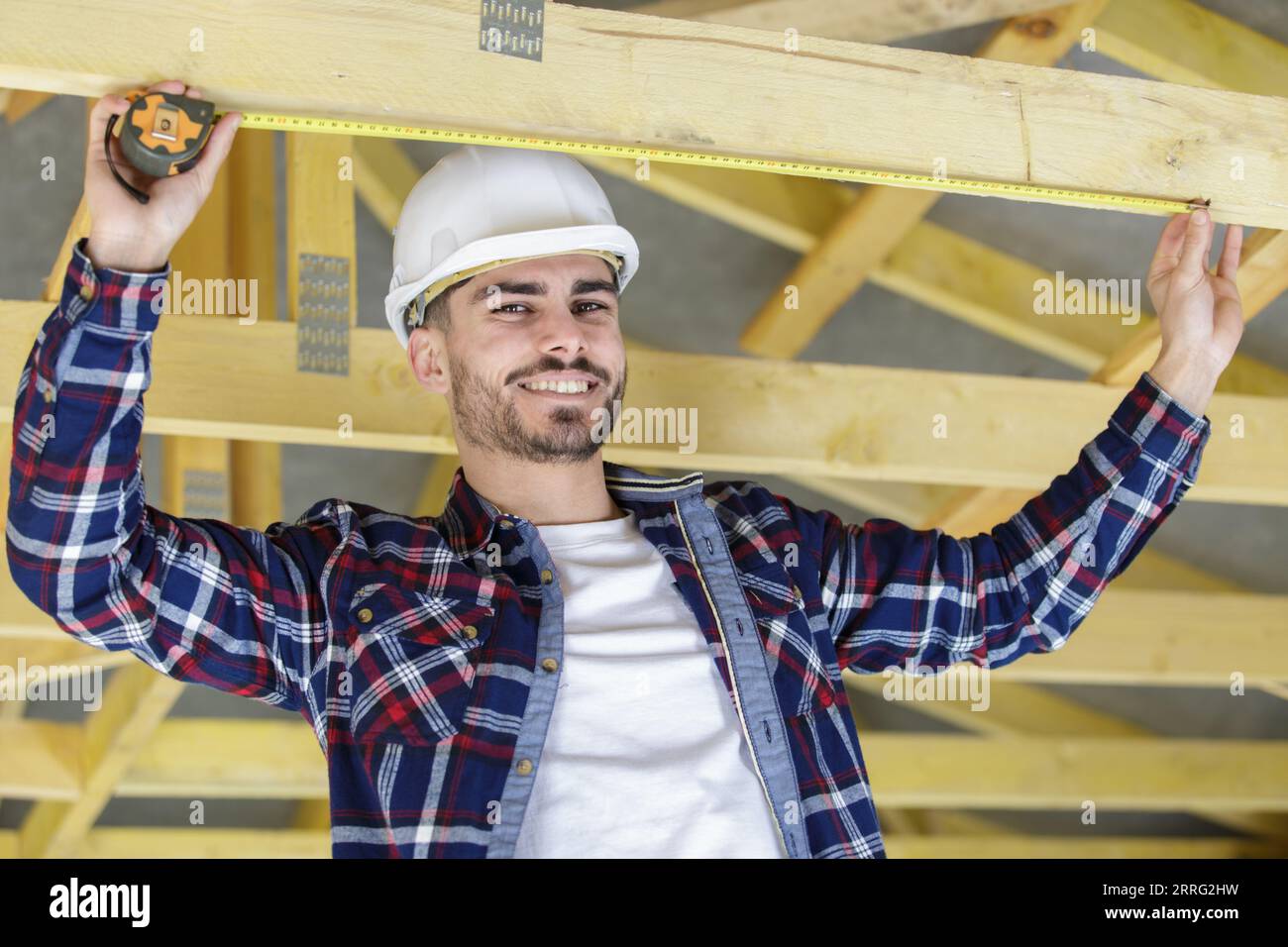 Man using tape measure hi-res stock photography and images - Alamy