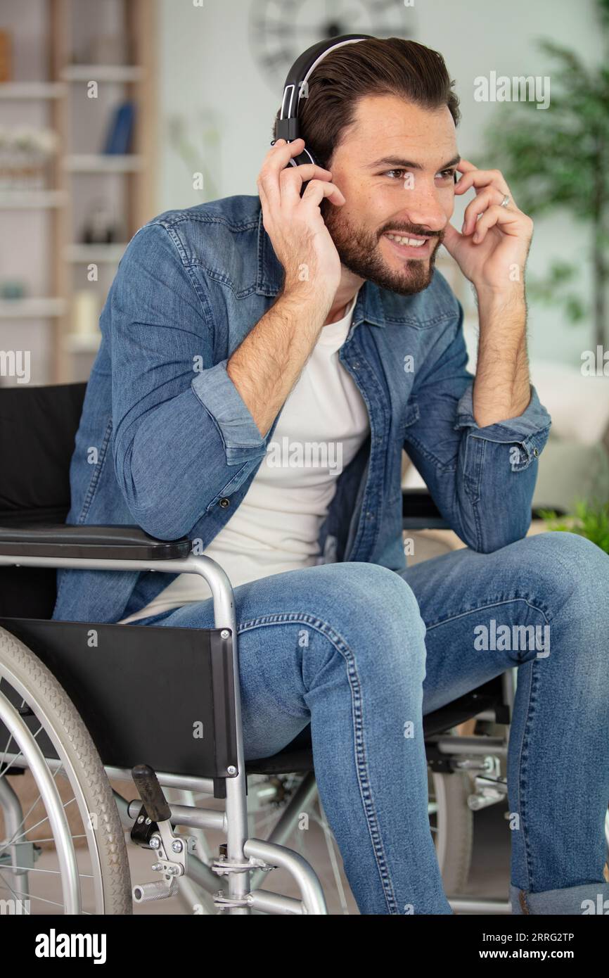 disabled man on wheelchair listening music Stock Photo - Alamy