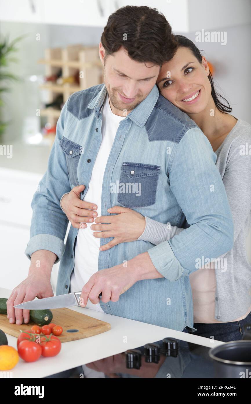 loving couple cooking together in the kitchen at home Stock Photo - Alamy
