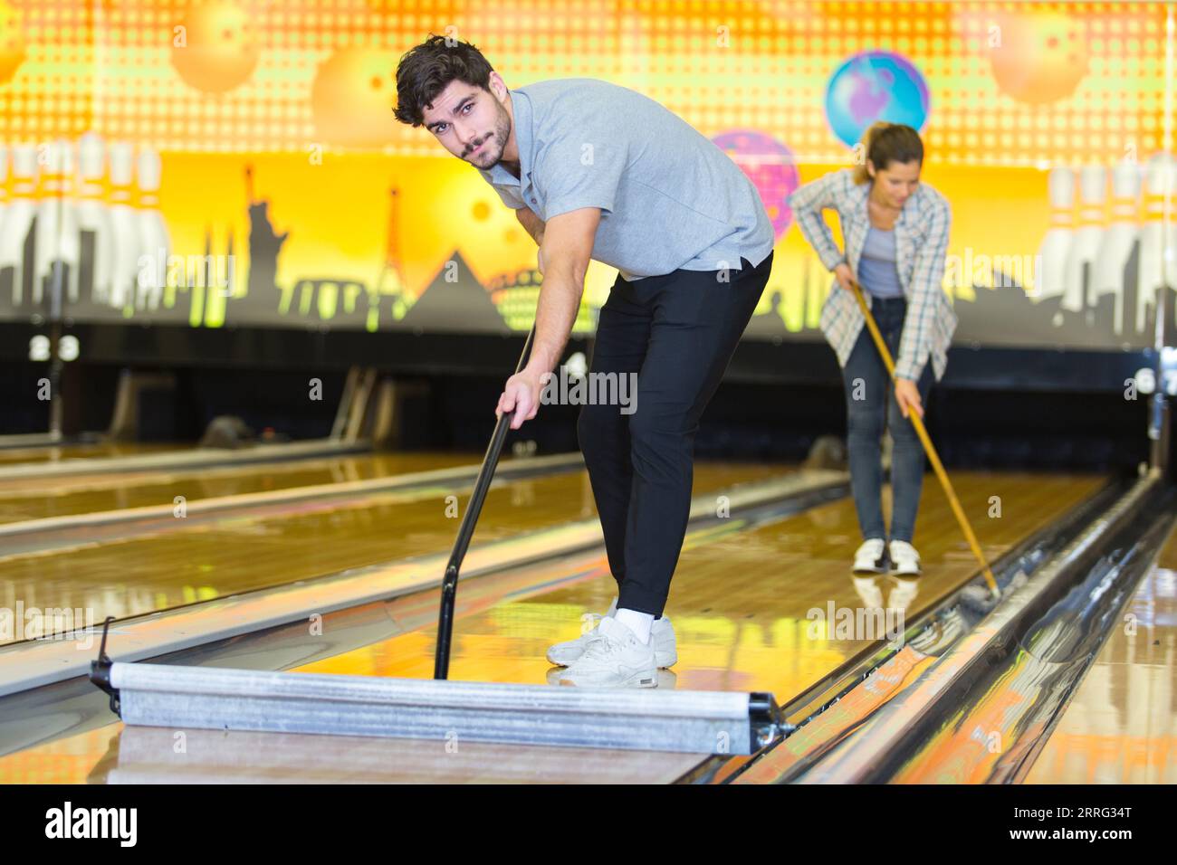 cleaning team at work on bowling alley Stock Photo - Alamy