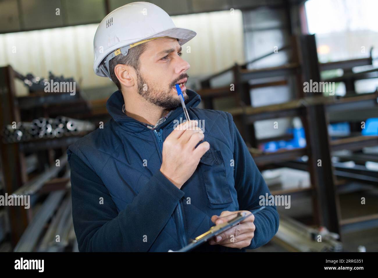 engineer taking notes at control room in factory Stock Photo - Alamy