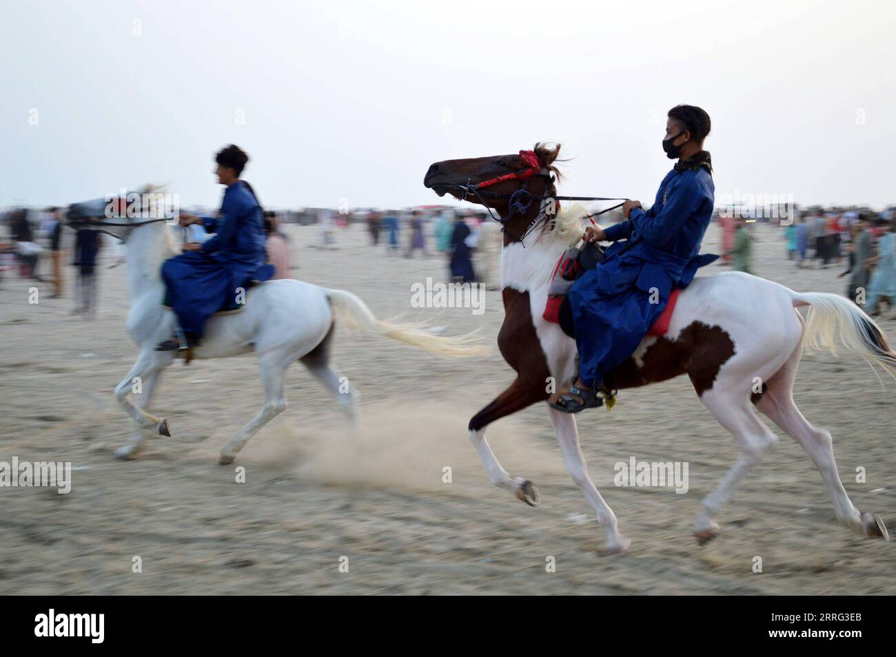 220505 -- KARACHI, May 5, 2022 -- People enjoy horse riding during the ...