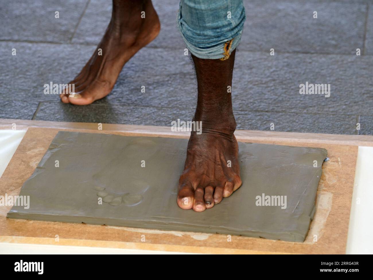 Sir Mo Farah puts his feet in concreate at South Shields metro station ...
