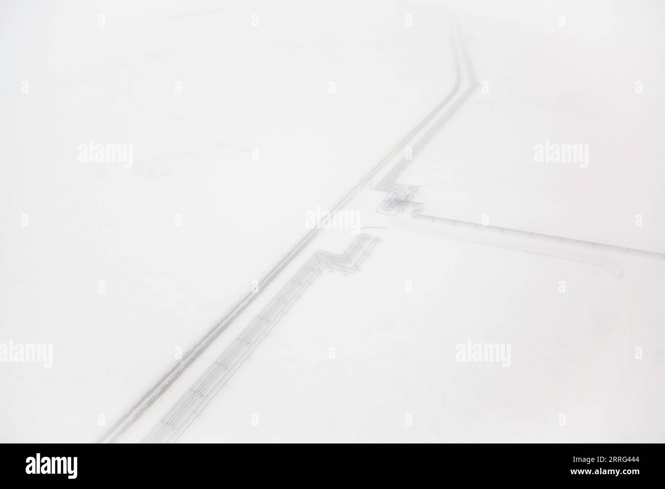 Oil pipeline and iceroad leading from the ConocoPhillips oilwells in ...