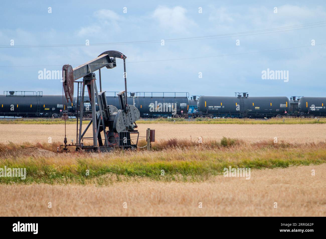A pump jack pumps oil from a shale oil well outside Williston, a ...