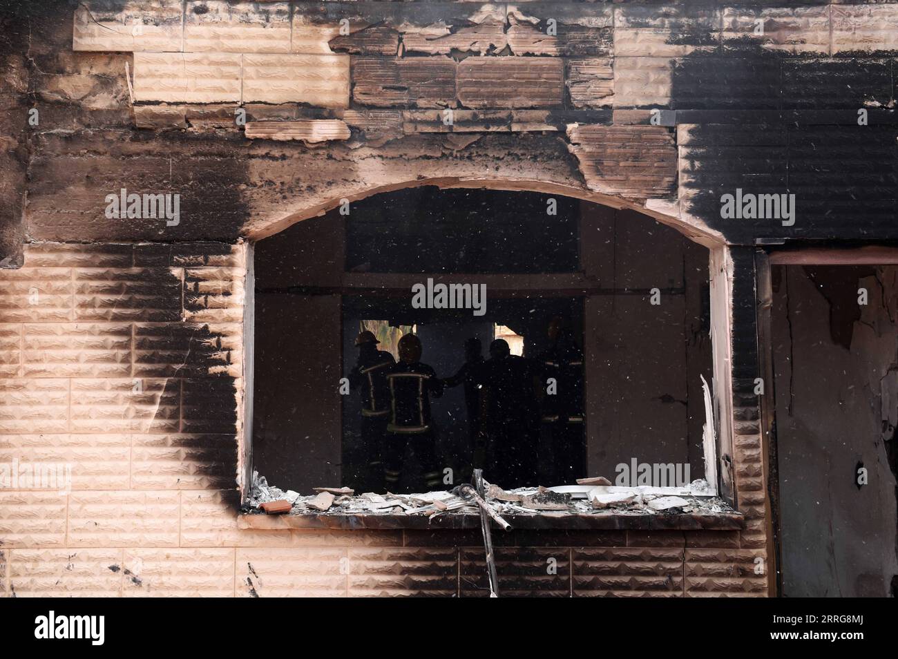 220513 -- JENIN, May 13, 2022 -- People inspect a destroyed house after ...