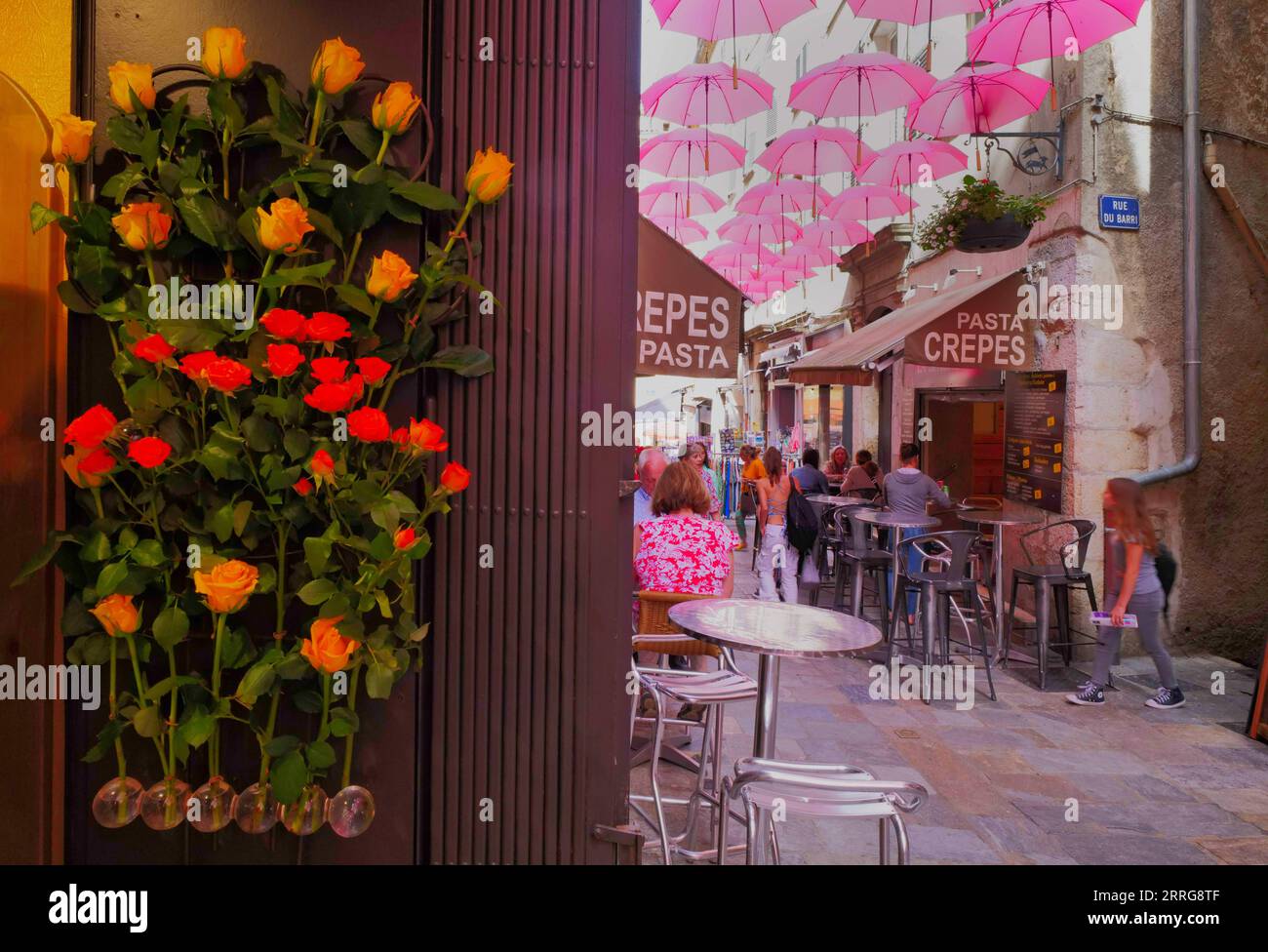 220513 -- GRASSE, May 13, 2022 -- Roses and pink umbrellas are seen ...