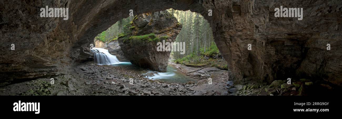 Rushing water carves a path through the limestone of Johnston Canyon in ...