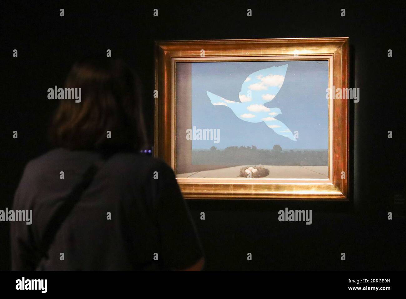 220516 -- BRUSSELS, May 16, 2022 -- A visitor looks at The Return ...