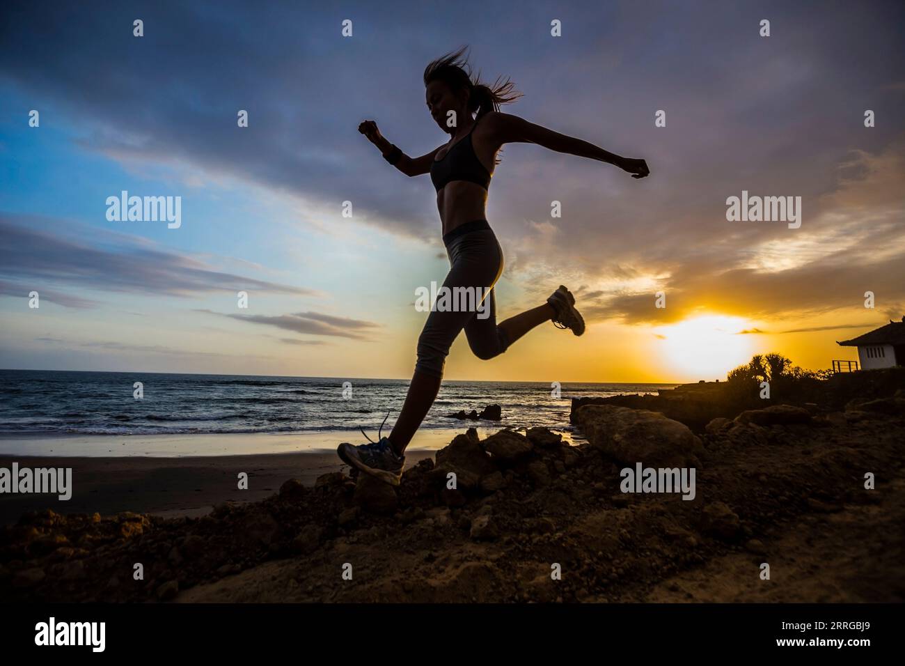 Running on the beach in Bali, Indonesia Stock Photo - Alamy