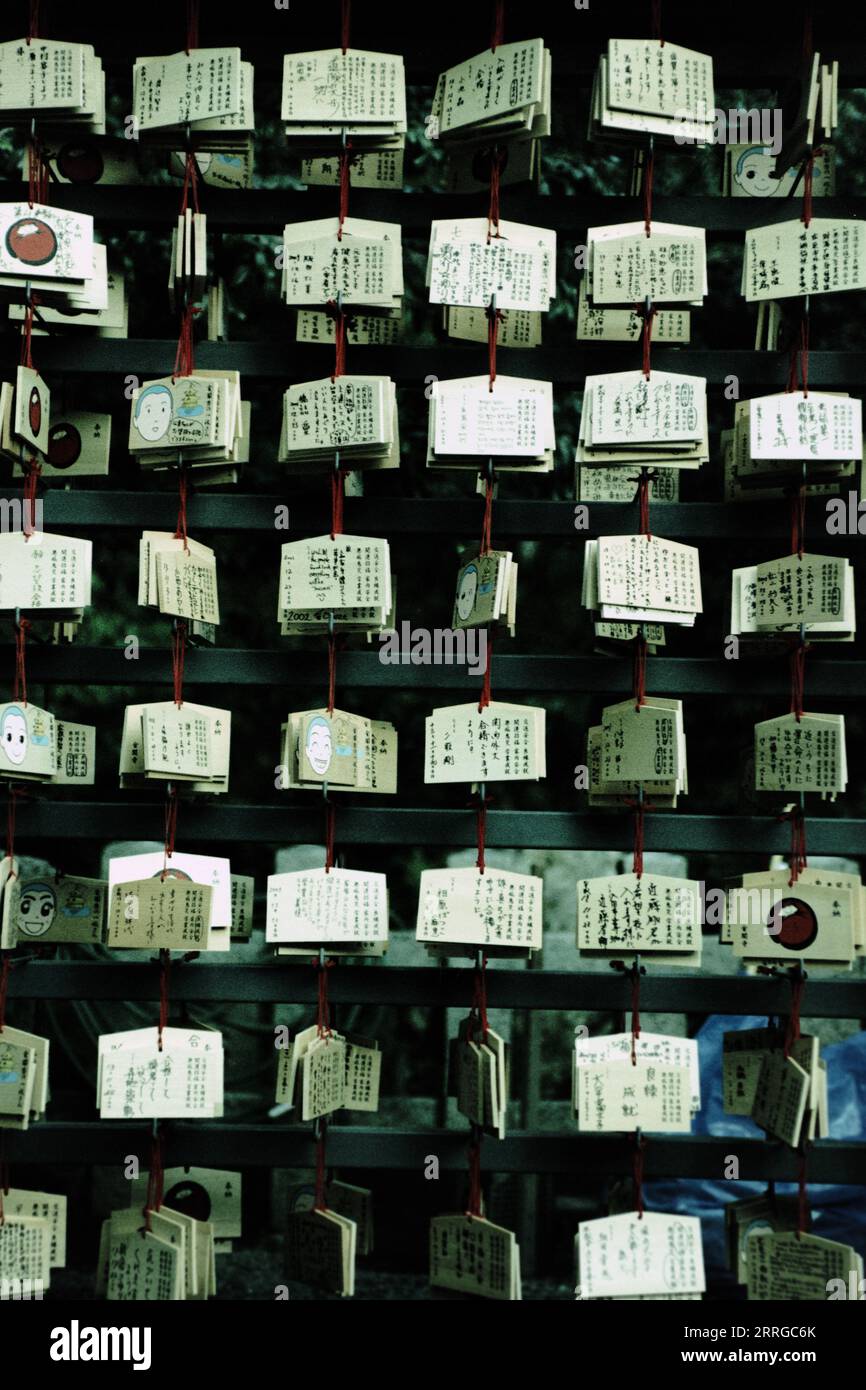 A wall featuring wishing cards in Japanese temple Stock Photo - Alamy
