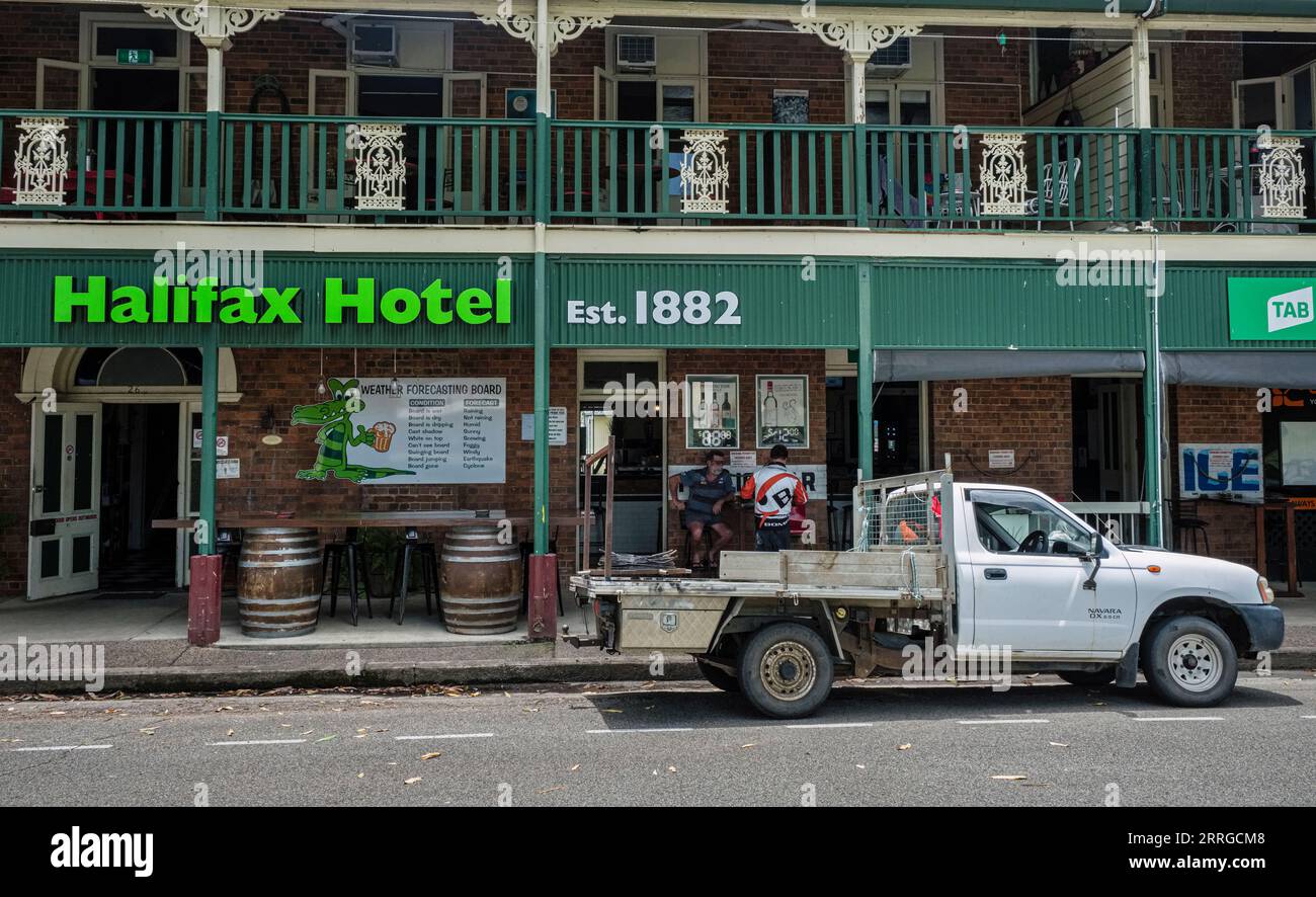 A typical Australian scene - drinkers sit in the shade outside a ...