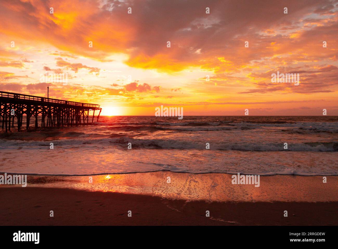 Sunrise over the pawley's island fishing pier showing hurricane damage ...