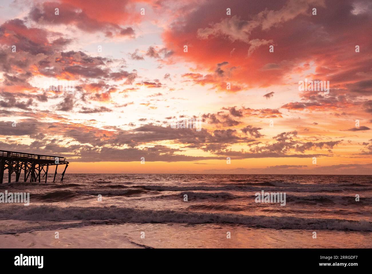 Sunrise over the pawley's island fishing pier showing hurricane damage ...