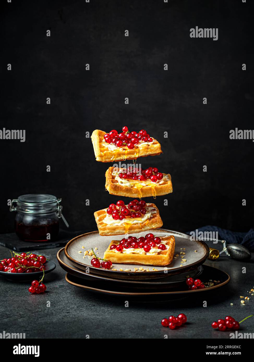 still life with sweet waffles on black table. Food levitation Stock ...