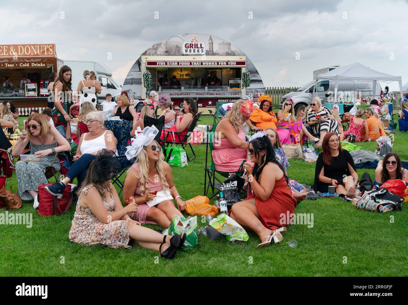 Crowds of people enjoy Ladies Day at the races in Beverley, Yorkshire ...