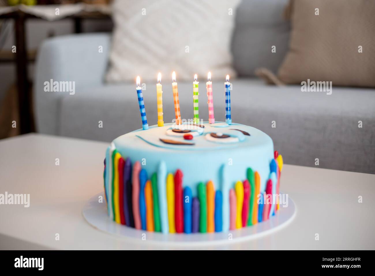 Cute preschool child, blowing candles on his cake, six years old, going ...