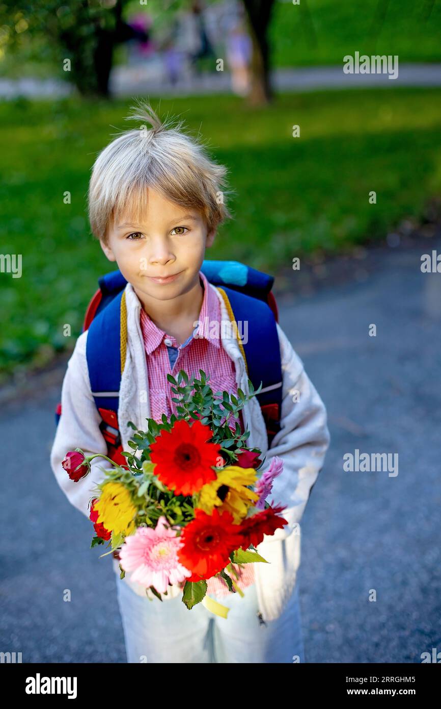 First day at school for a firstgraden, child starting school, bringing ...