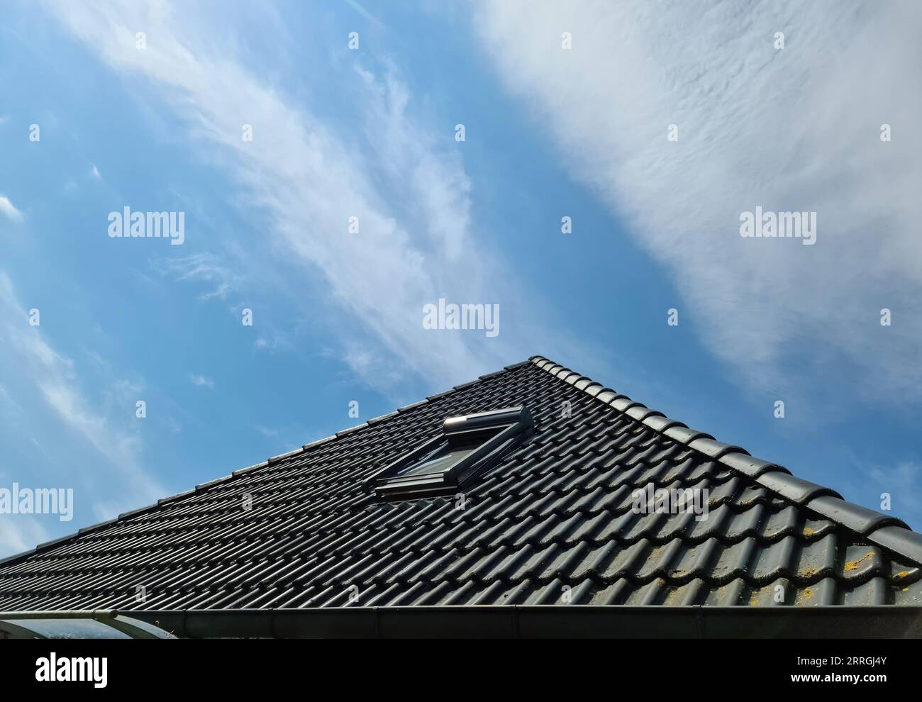 Open Roof Window In Velux Style With Black Roof Tiles Stock Photo - Alamy