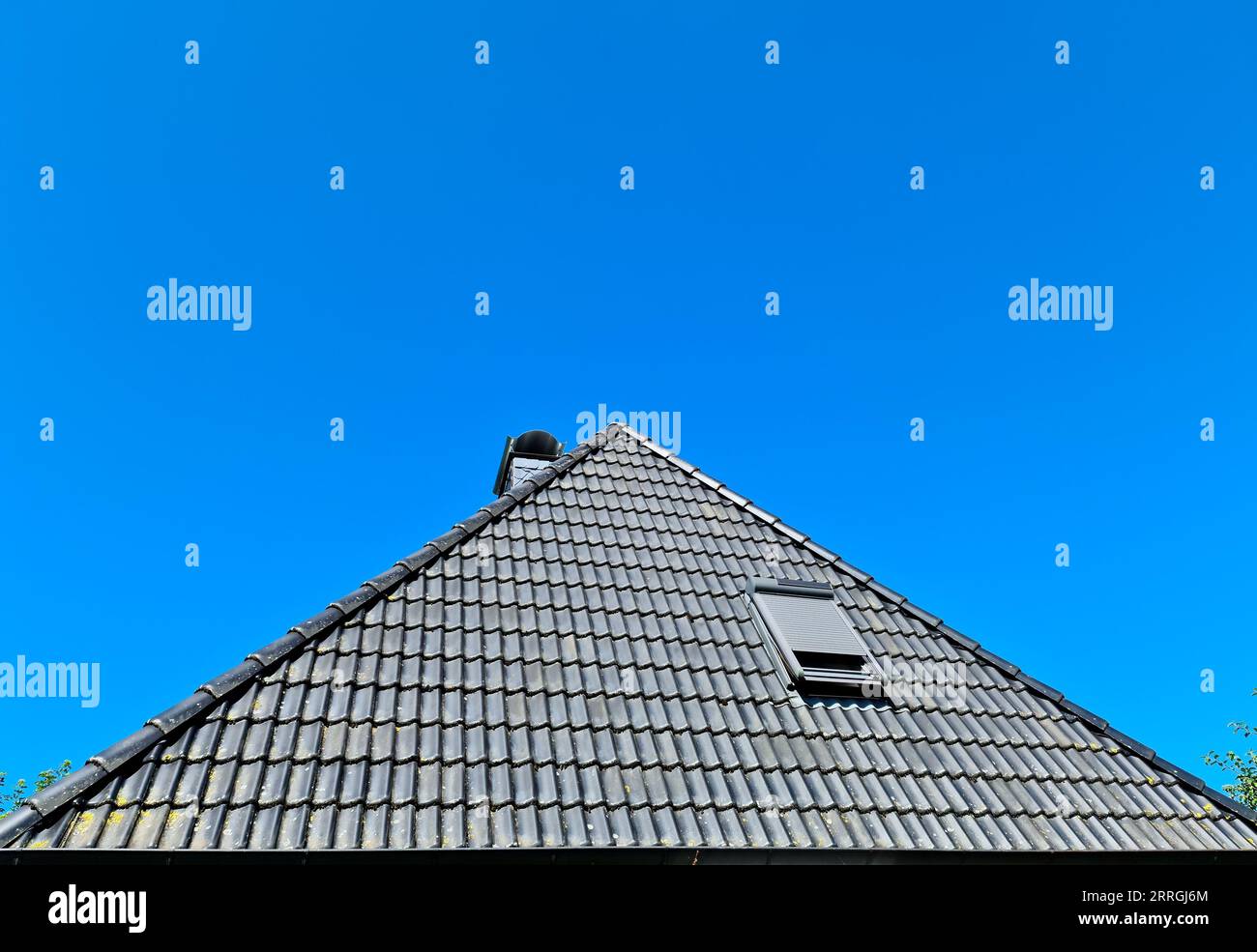 Open Roof Window In Velux Style With Black Roof Tiles Stock Photo - Alamy