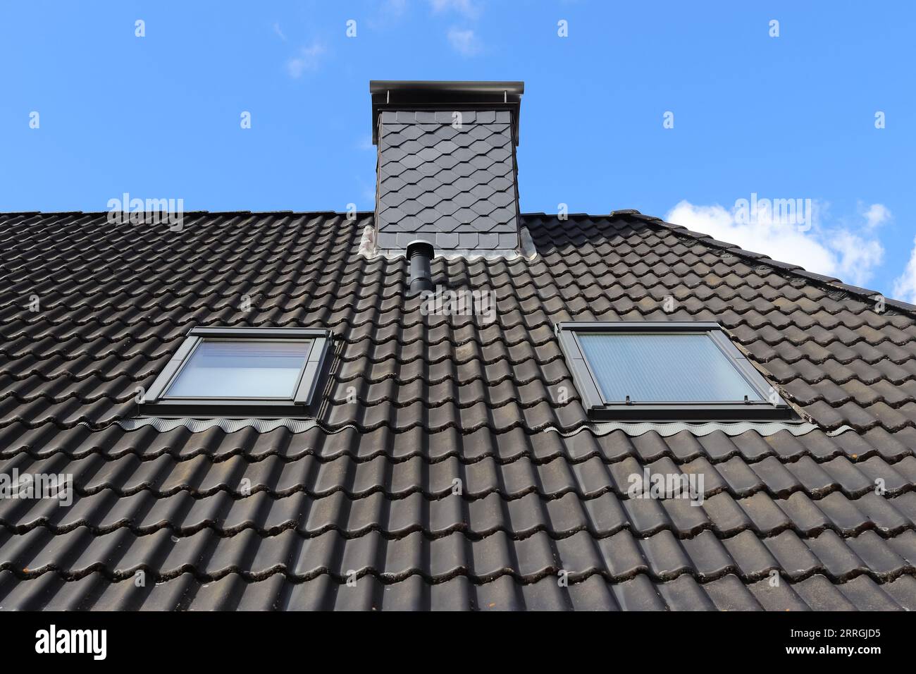 Roof Window In Velux Style With Black Roof Tiles Stock Photo - Alamy