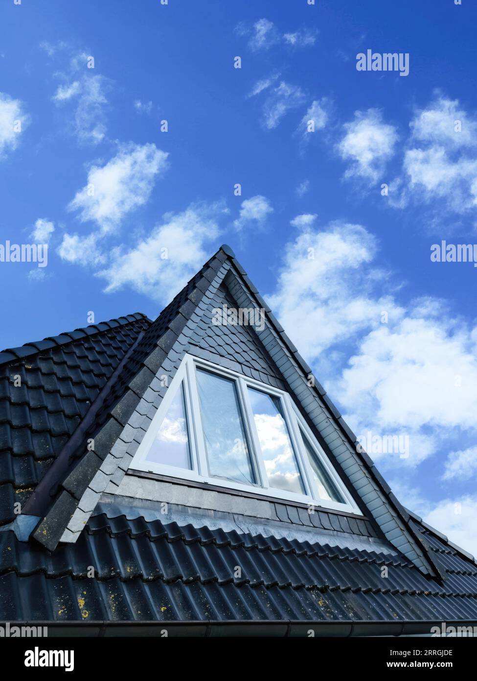 Roof Window In Velux Style With Black Roof Tiles Stock Photo - Alamy