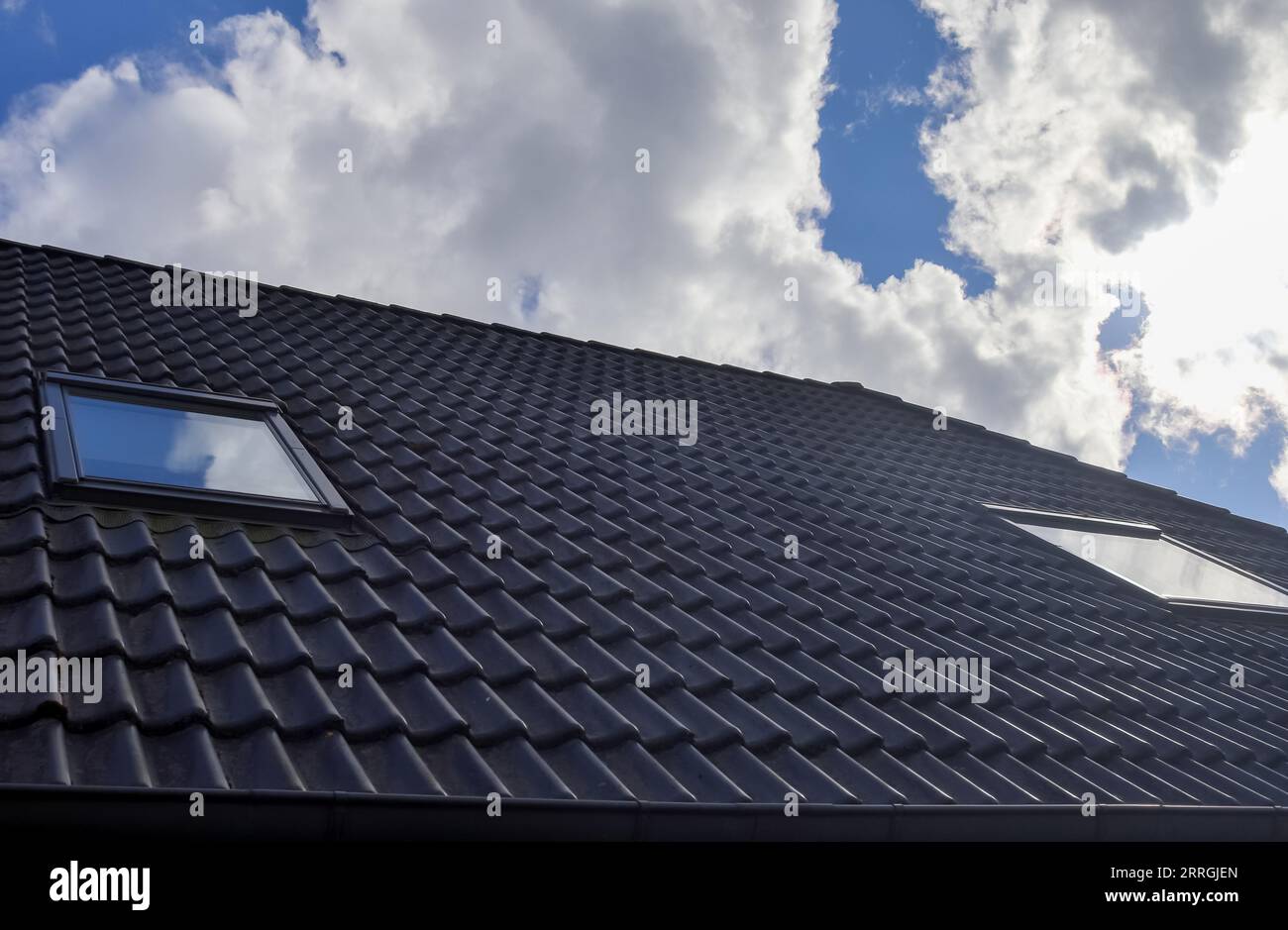 Roof Window In Velux Style With Black Roof Tiles Stock Photo - Alamy