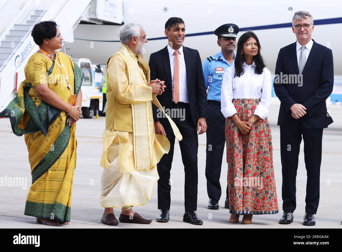 Prime Minister Rishi Sunak and wife Akshata Murty are met on the tarmac ...