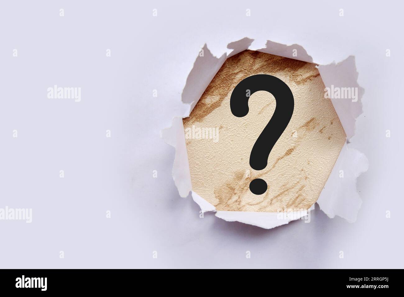 Torn out white paper with question mark symbol. White torn paper ...