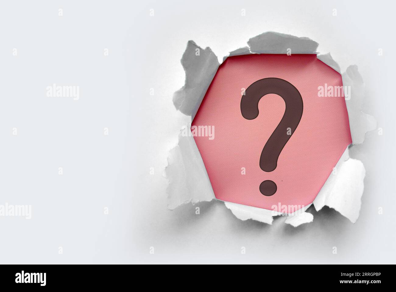 Torn out white paper with question mark symbol. White torn paper ...
