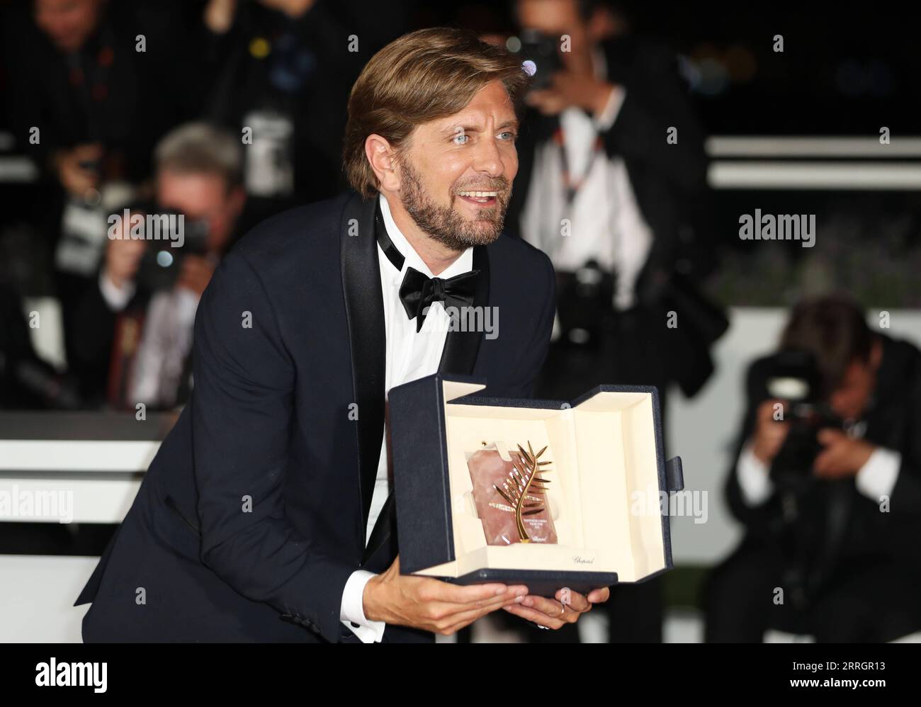 220529 -- CANNES, May 29, 2022 -- Swedish director Ruben Ostlund poses during a photocall after ...