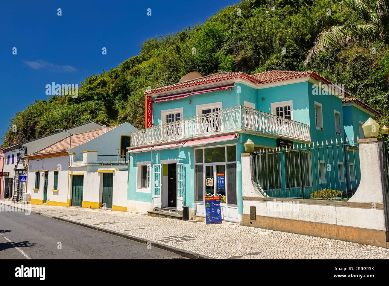 Shops and restaurants along the town square in the historic village of ...