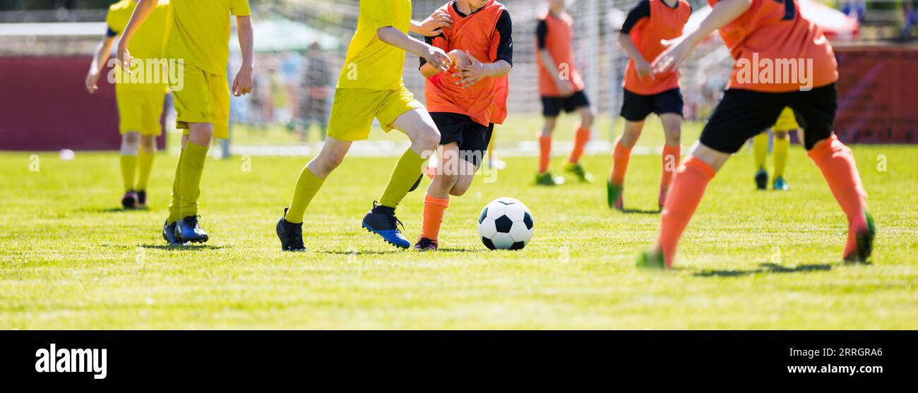 European soccer match between youth teams. Young school boys playing a ...