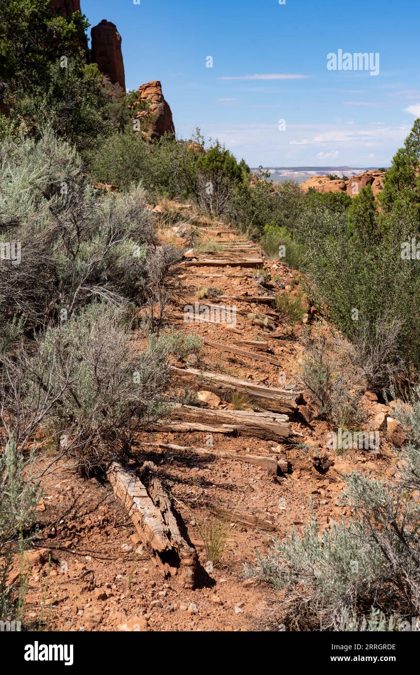 Weathered mine car rail cross ties run through the sage brush at the ...
