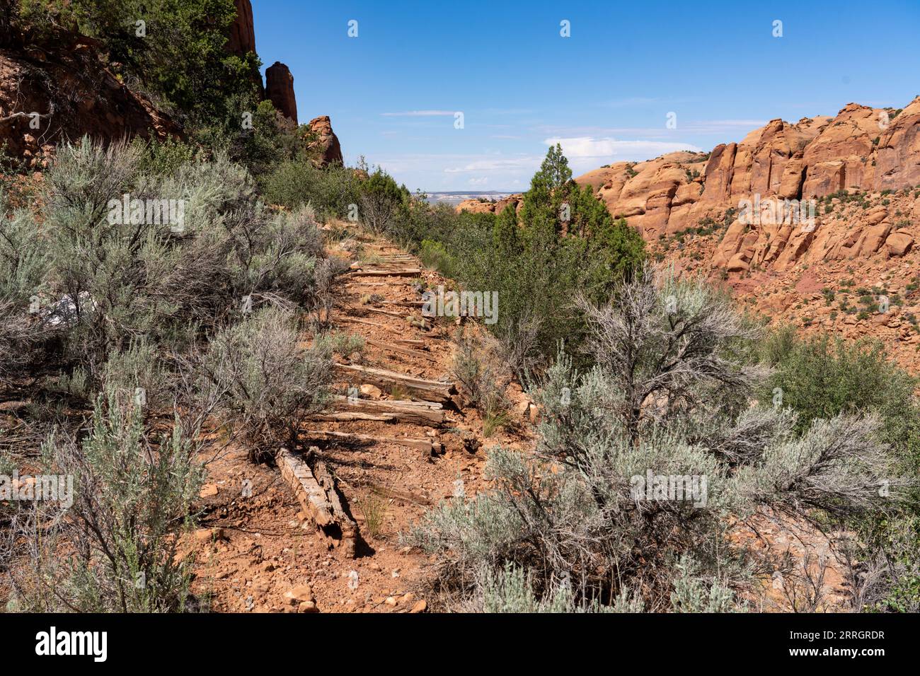 Weathered mine car rail cross ties run through the sage brush at the ...