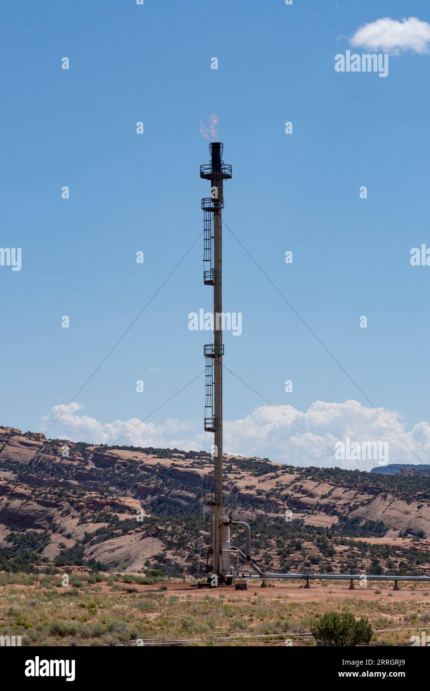 A smokestake at a gas recycling facility flares of poisonous H2S ...