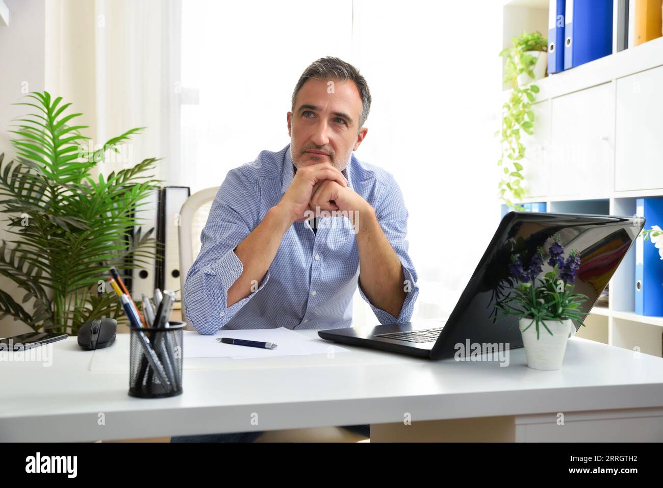 Imaginative entrepreneurial adult man getting creative inspiration at ...