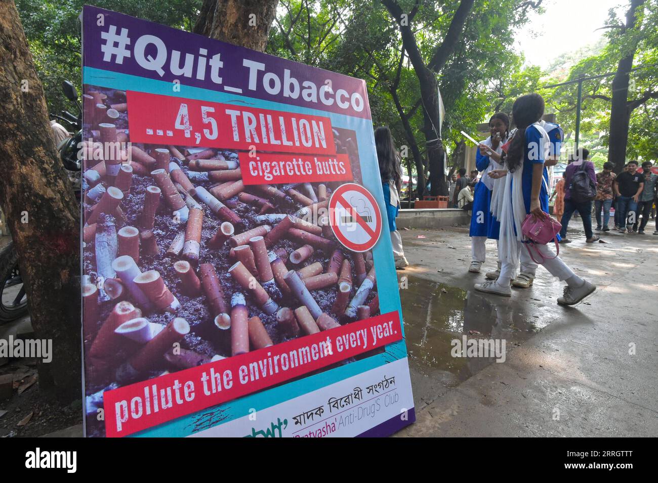 220531 -- DHAKA, May 31, 2022 -- People are seen next to an anti ...