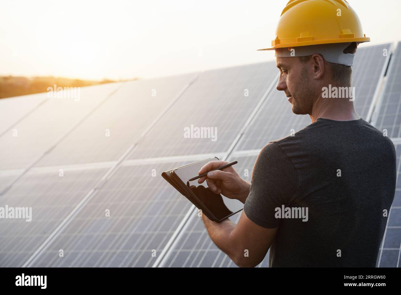Engineer working at solar panels factory outdoor - Photovoltaic ...