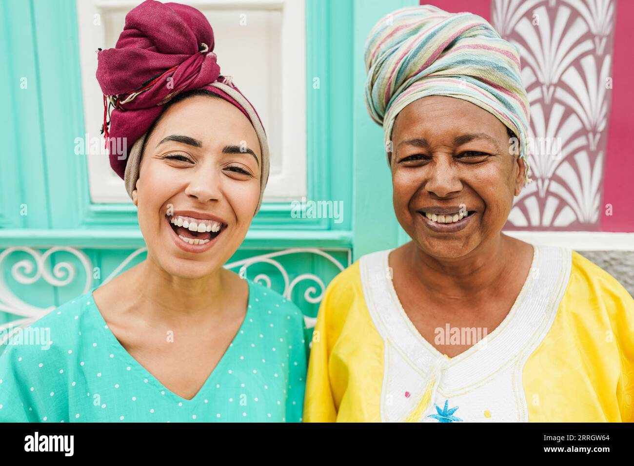 Happy african mother and her daughter wearing afro clothes - Ethnic ...