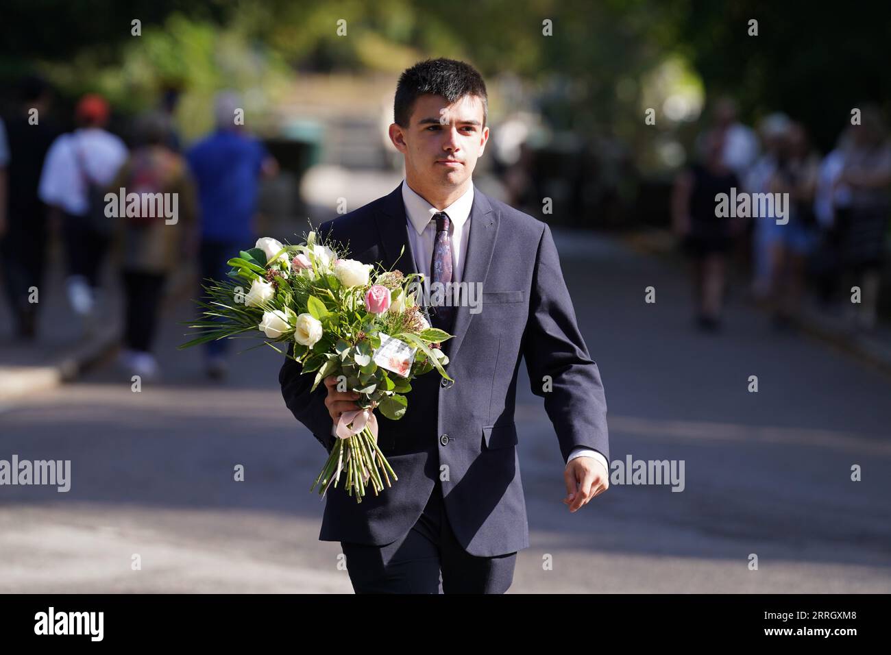 Kai Suleman MSYP for Aberdeenshire West leaves flowers at the gates of ...