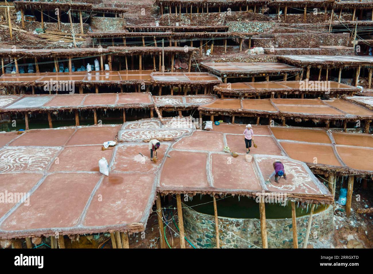Collecting salt from salt pan hi-res stock photography and images - Alamy