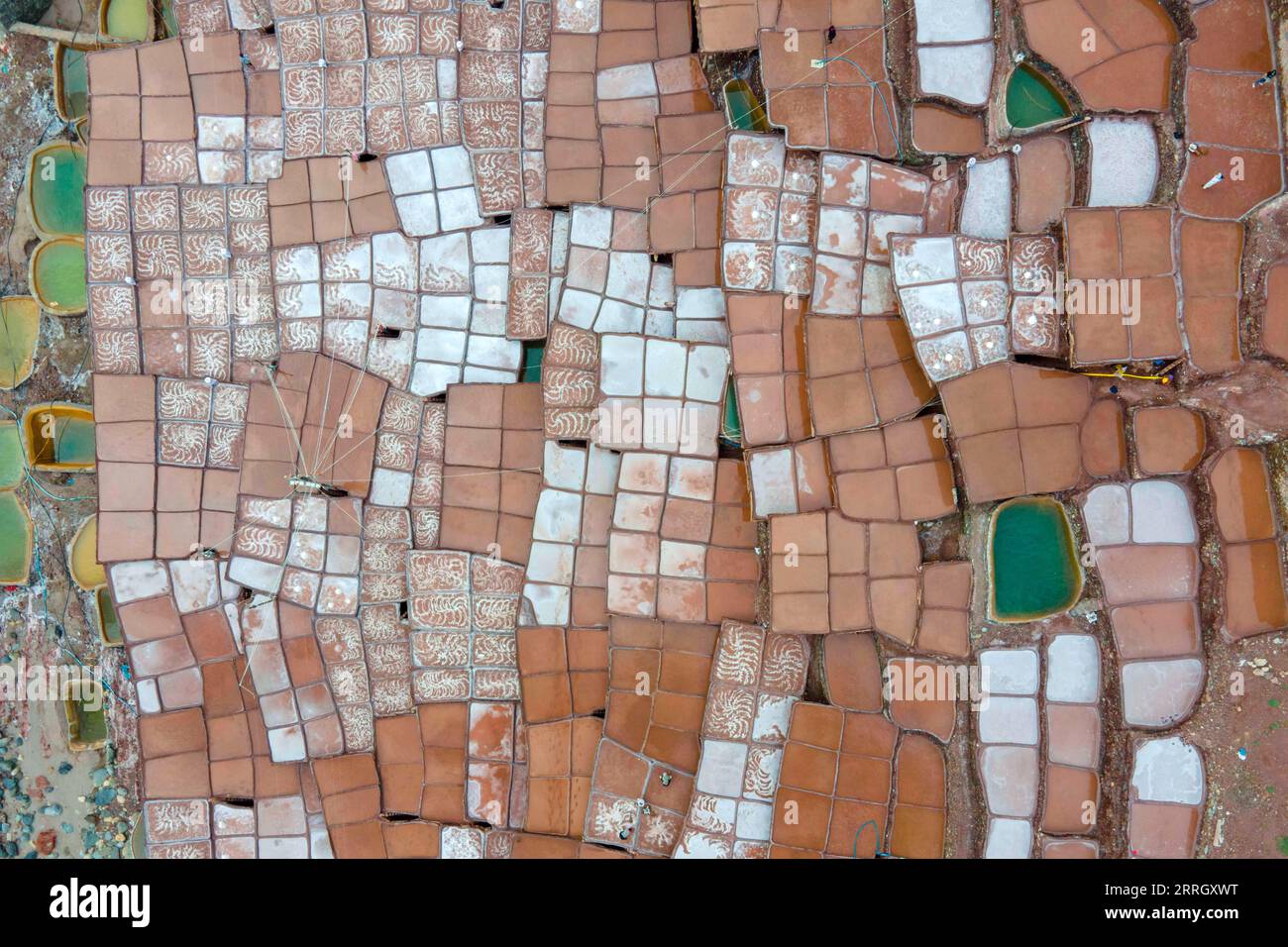 Collecting salt from salt pan hi-res stock photography and images - Alamy