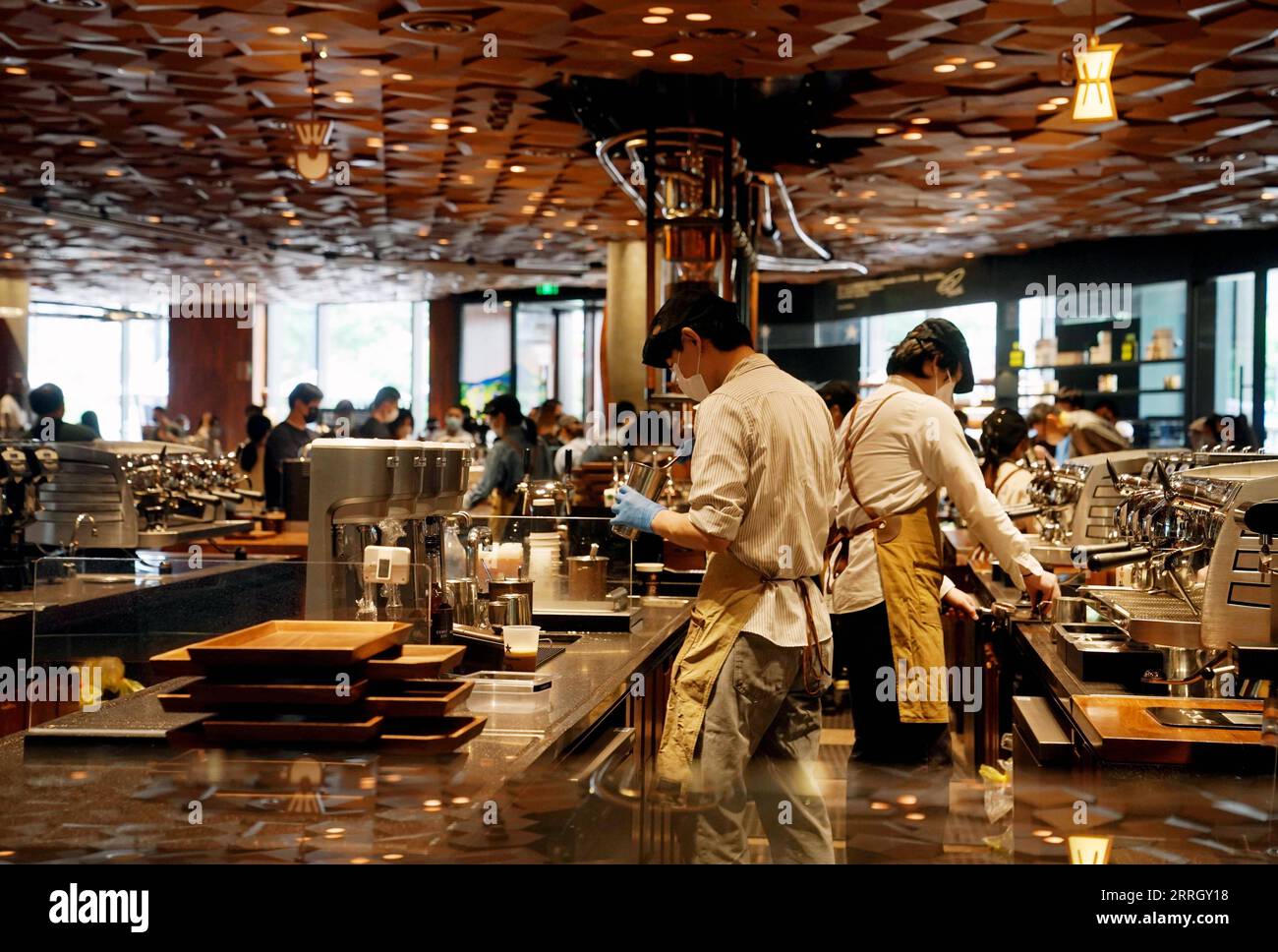 220603 -- SHANGHAI, June 3, 2022 -- Coffee makers work at the Starbucks ...