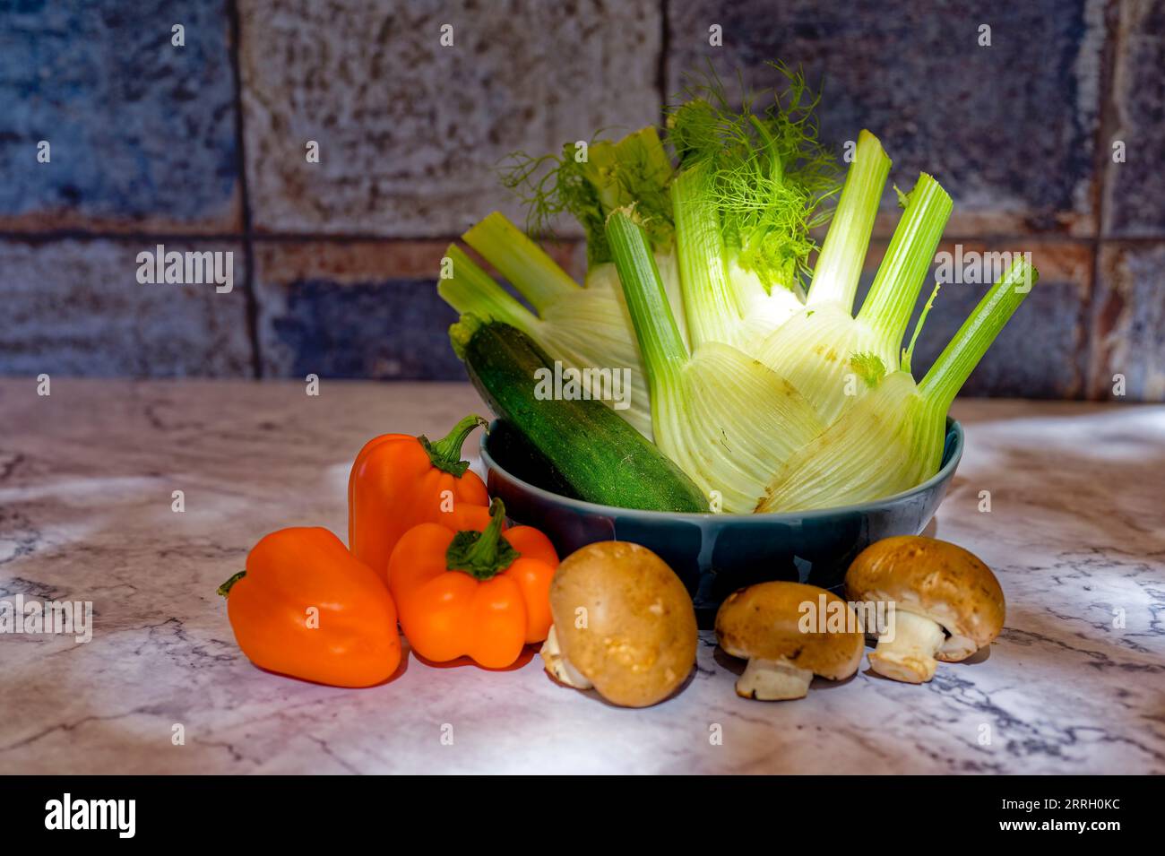 Various raw and fresh vegetable ingredients for cooking in front of a ...